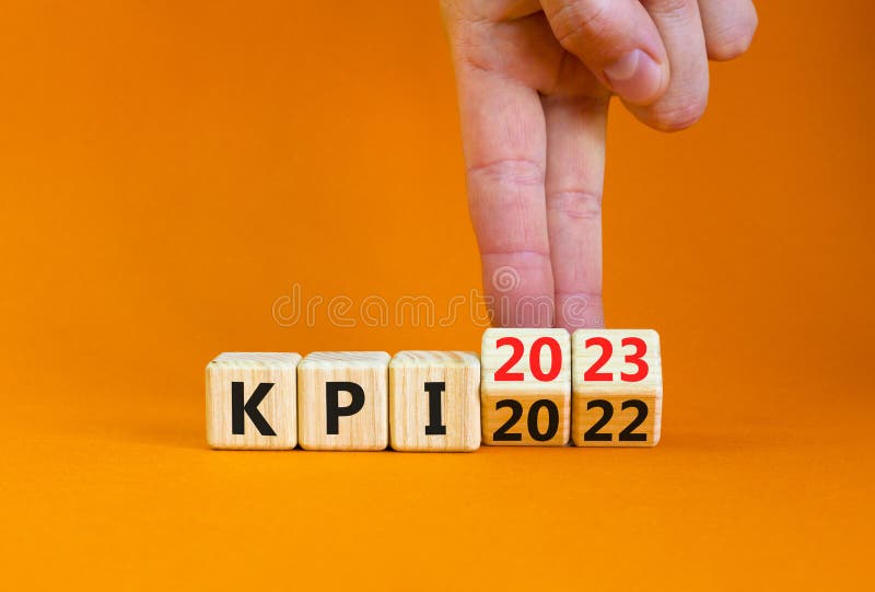 KPI, Key Performance Indicator Symbol. Businessman Turns Wooden Cubes ... KPI, Key Performance Indicator Symbol. Businessman Turns Wooden Cubes ...