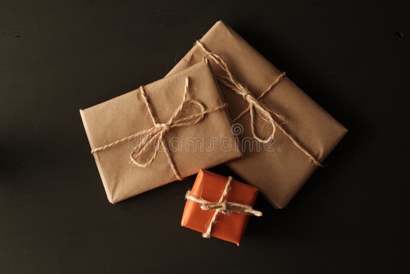 Kraft Paper Gift Packages with Black Background Stock Photo - Image of ...