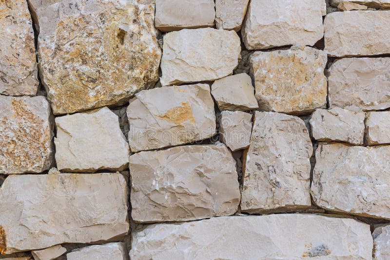 Patterns in a Rough Cut Stone Wall Stock Photo - Image of rock, people ...