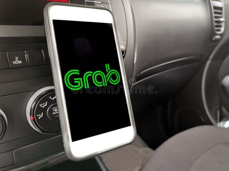 Car Driver Using Smartphone with with Grab App on Dashboard. Editorial ...
