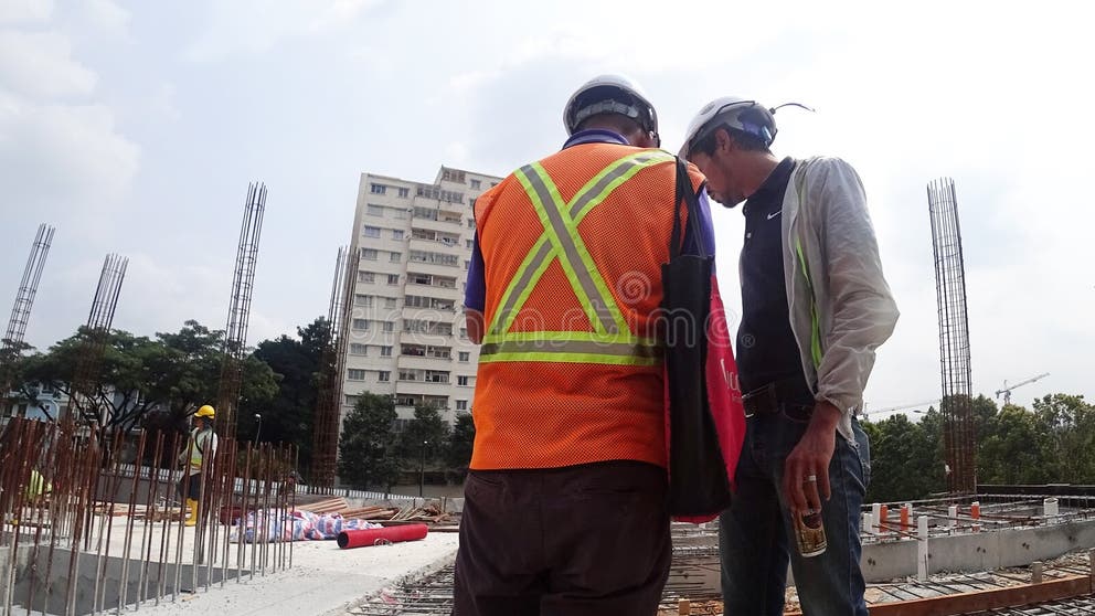 Construction Workers Discuss among Themselves Regarding Technical ...