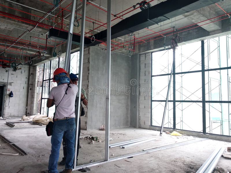 Drywall Installation Work in Progress by Construction Workers at the ...