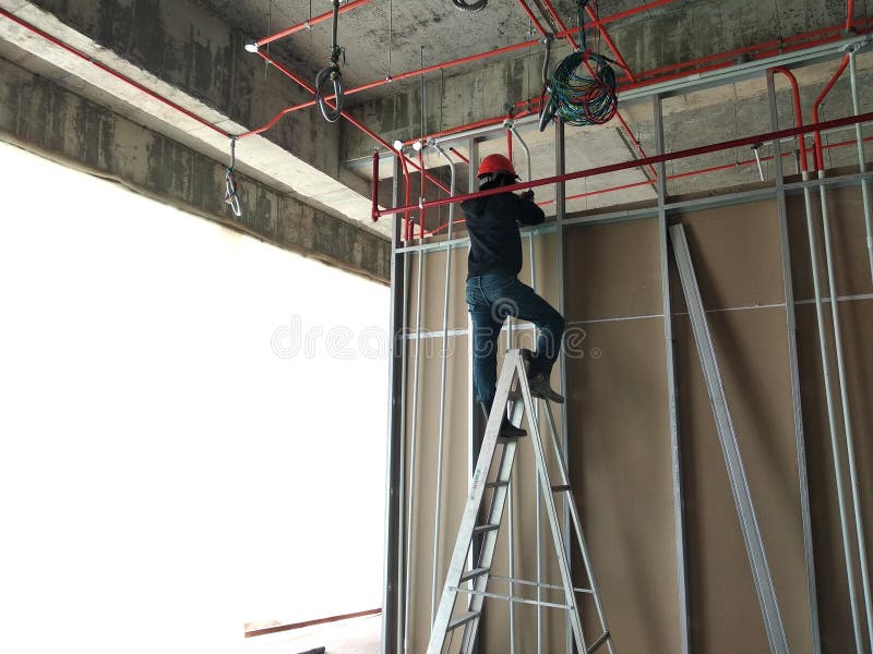 Drywall Installation Work in Progress by Construction Workers at the ...