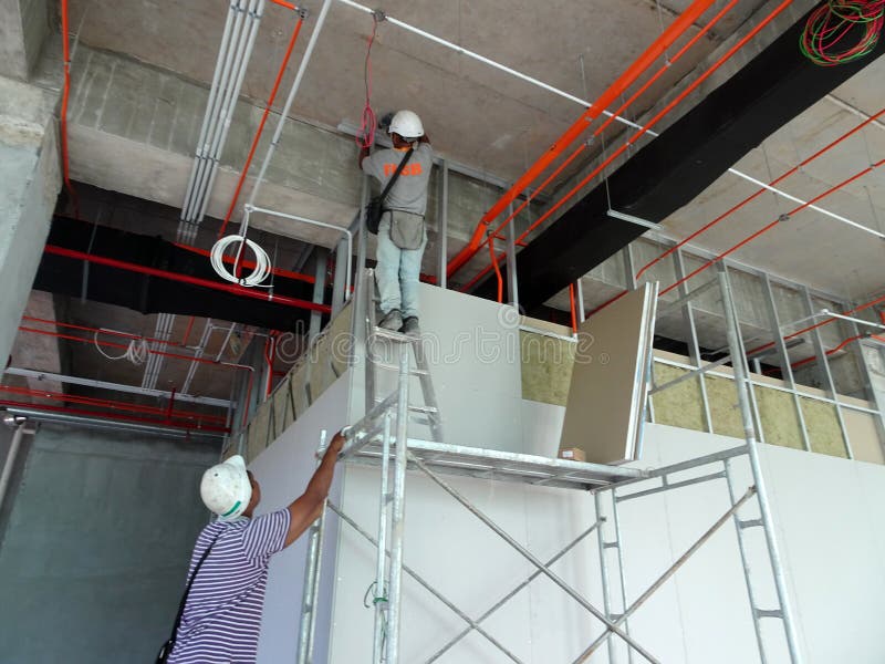 Drywall Installation Work in Progress by Construction Workers at the ...