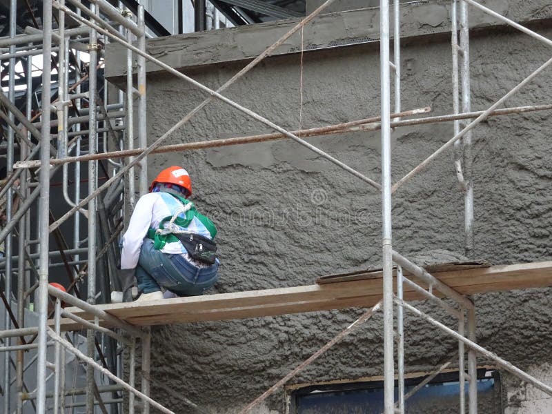 Brickwall Plastered by Construction Workers Using Cement Plaster ...