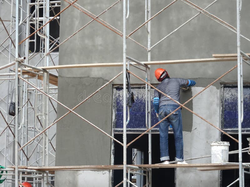 Brickwall Plastered by Construction Workers Using Cement Plaster ...