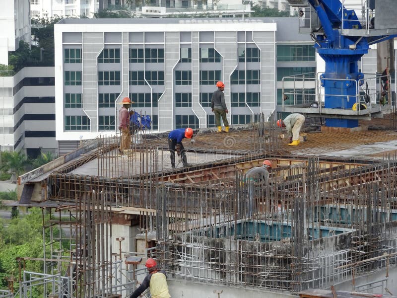 Construction Workers Working at Height at the Construction Site ...