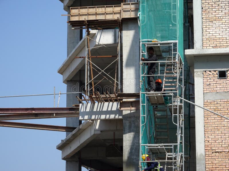Construction Workers Working at Height at the Construction Site ...