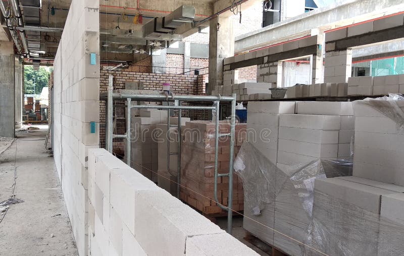 Brickwork by Construction Workers at the Construction Site. Editorial ...