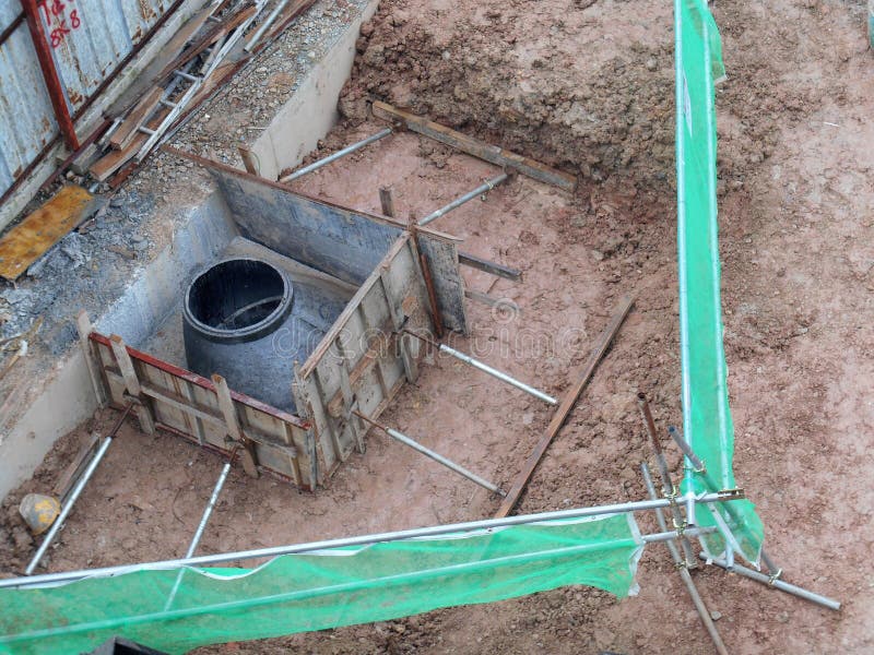 Underground Drainage Manhole Under Construction by Construction Workers ...