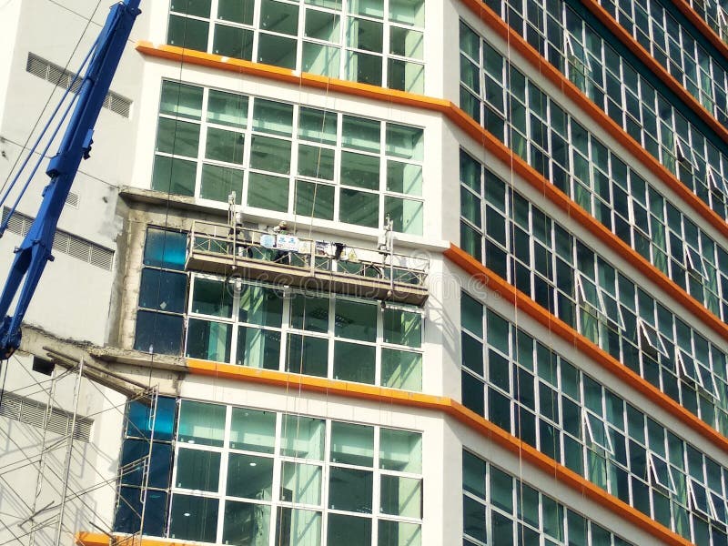 Workers are in the Process of Cleaning and Maintenance Exterior the ...