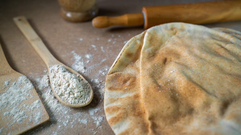 Kuboos or Khubz - Arabic Bread on a Brown Table in the Kitchen Stock ...