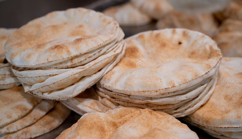 Kuboos or Khubz - Fresh Pita Bread Togeather in a Table Table Stock ...