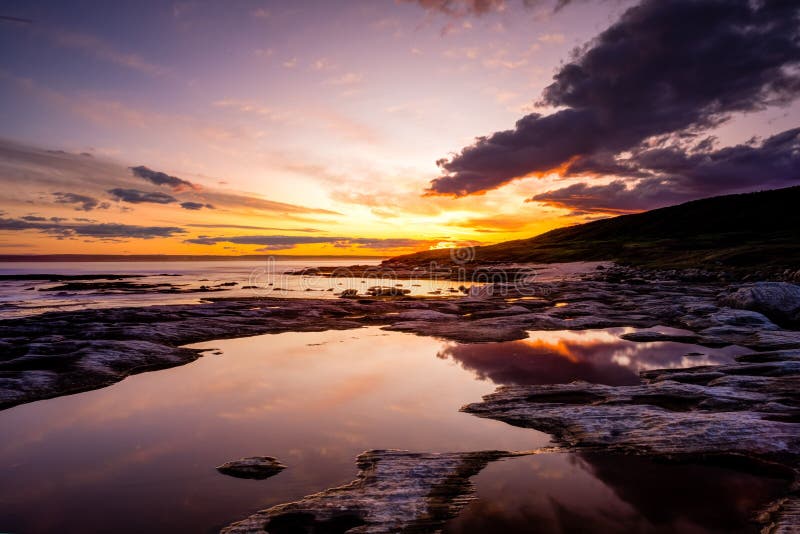Kurnell Beach View at Sunset with Sunlit Rocky Cliffs and Water with ...