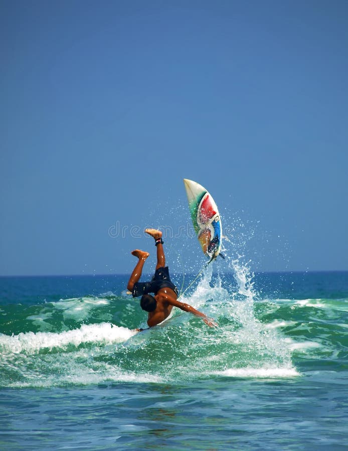 Kuta beach surfing action editorial photography. Image of asia - 23839872