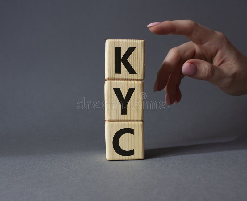 KYC - Know Your Customer. Wooden Cubes with Word KYC. Businessman Hand ... KYC - Know Your Customer. Wooden Cubes with Word KYC. Businessman Hand ...