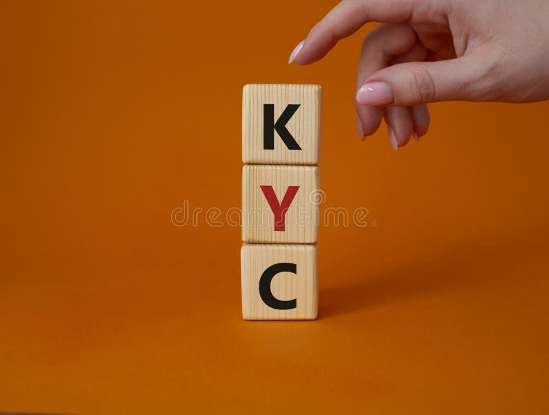 KYC - Know Your Customer. Wooden Cubes with Word KYC. Businessman Hand ... KYC - Know Your Customer. Wooden Cubes with Word KYC. Businessman Hand ...