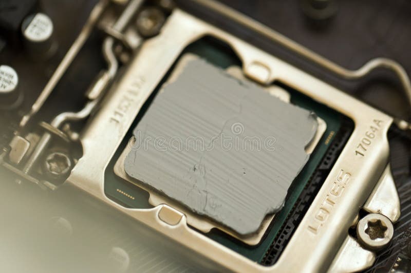 KYIV, UKRAINE - JANUARY 29, 2025 Applying Thermal Paste on a Processor ...