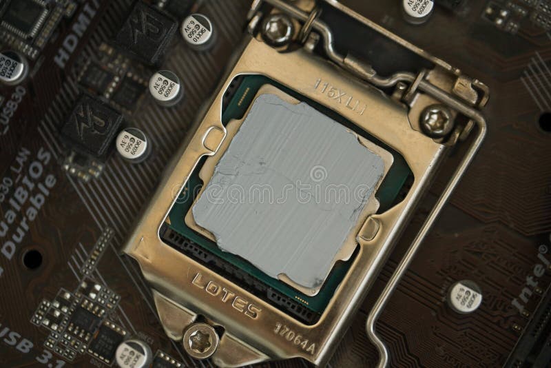 KYIV, UKRAINE - JANUARY 29, 2025 Applying Thermal Paste on a Processor ...
