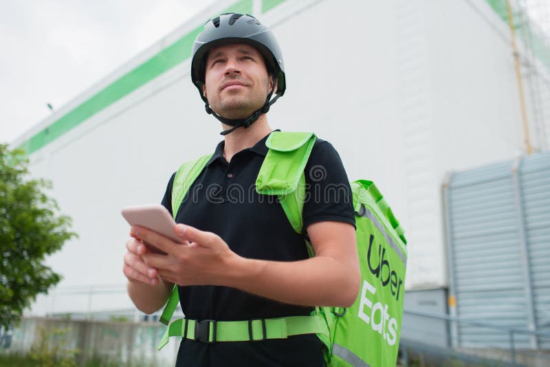 Kyiv, Ukraine - May 06, 2020: the Uber Eats Courier. the Food Delivery ... Kyiv, Ukraine - May 06, 2020: the Uber Eats Courier. the Food Delivery ...
