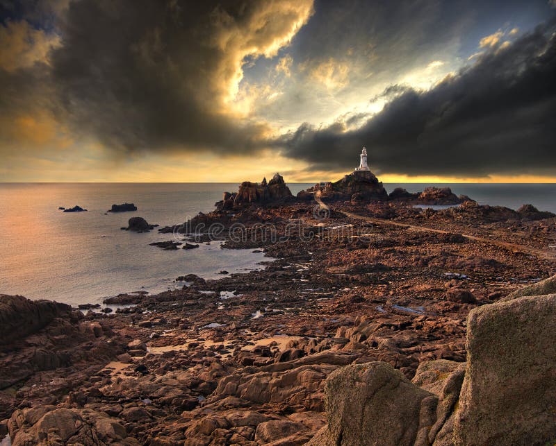 La Corbiere stock image. Image of clouds, rocks, lighthouse - 19555601