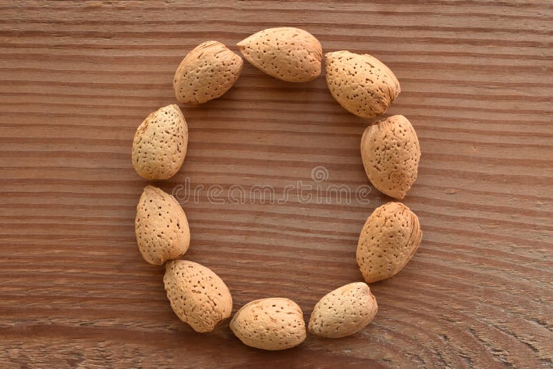 La Letra a Formada Con Las Almendras En La Madera Foto de archivo ...