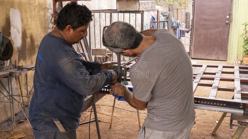 Blacksmith Working in a Backyard Workshop, La Paz, Baja California ...