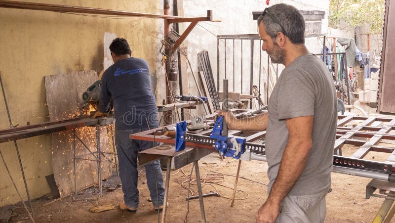 Blacksmith Working in a Backyard Workshop, La Paz, Baja California ...