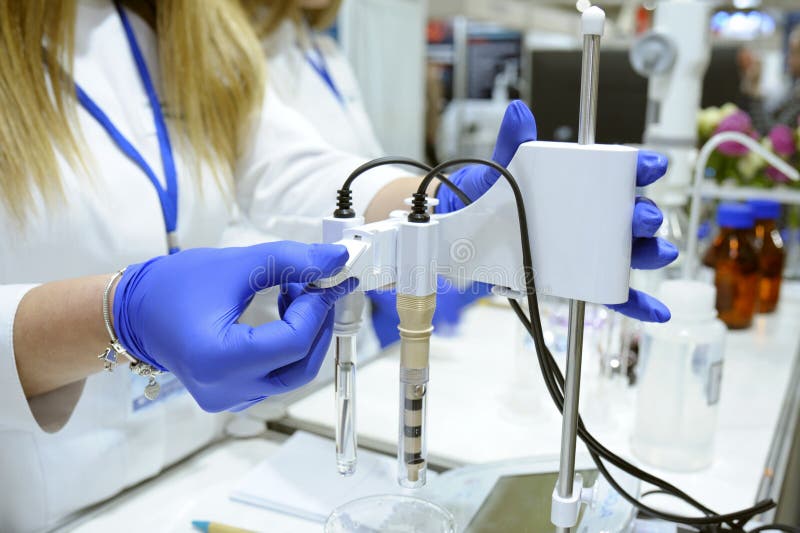 Lab Assistant Hands in Blue Gloves Adjusting the Ionometer To Measure ...