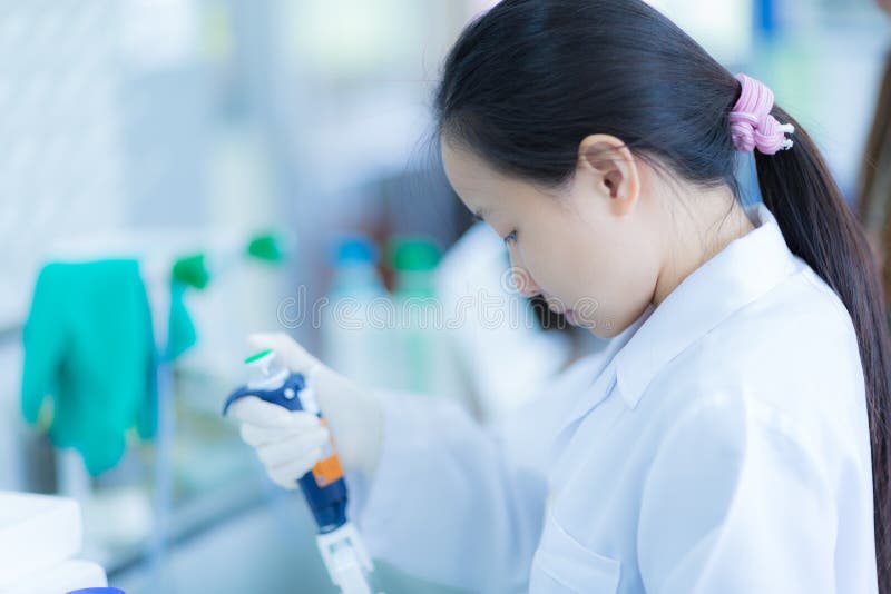 Lab Experiment stock photo. Image of coat, pipetting - 39683674