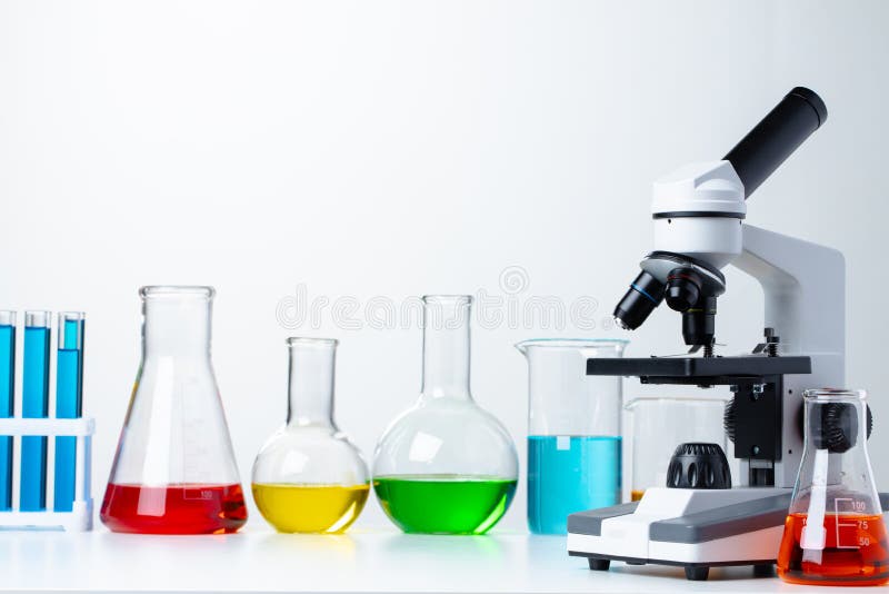 Lab Microscope with Laboratory Glassware on Desk Stock Image - Image of ...