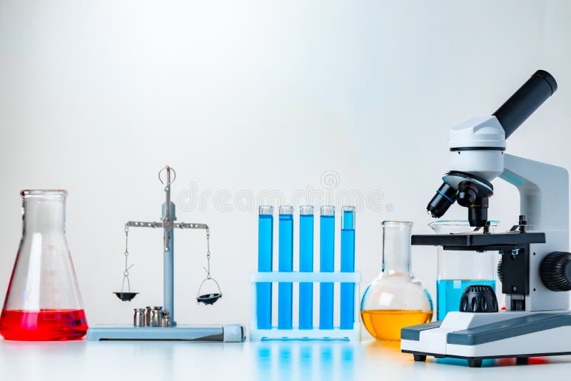 Lab Microscope with Laboratory Glassware on Desk Stock Image - Image of ...