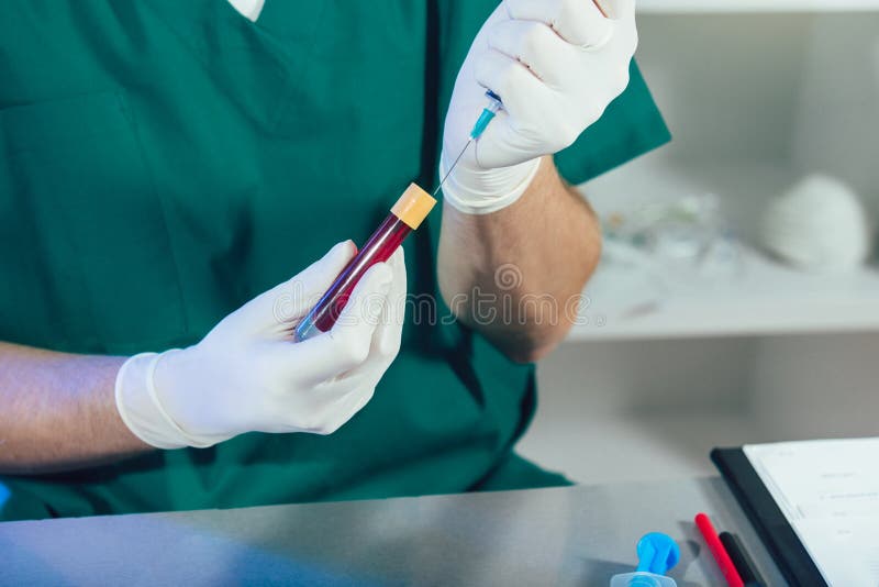 Lab Technician Assistant Analyzing a Blood Sample at Laboratory. Stock ...