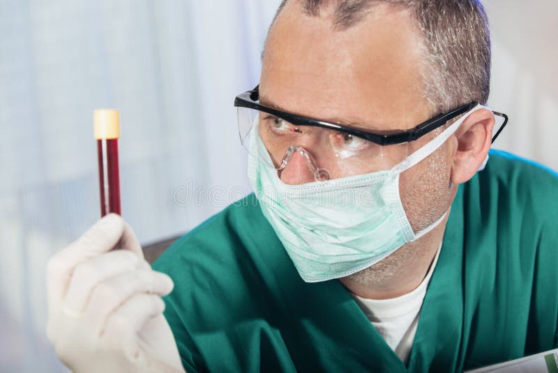 Lab Technician Assistant Analyzing a Blood Sample at Laboratory. Stock ...