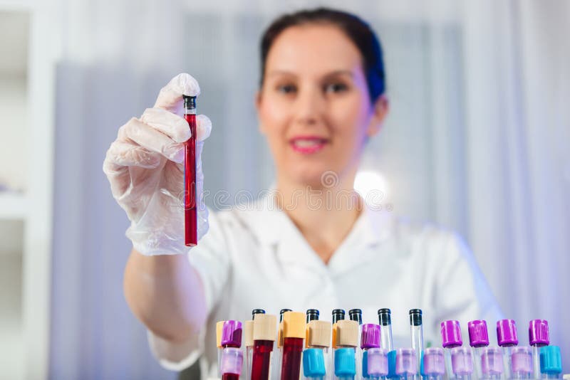 Lab Technician Assistant Analyzing a Blood Sample in Test Tube at ...