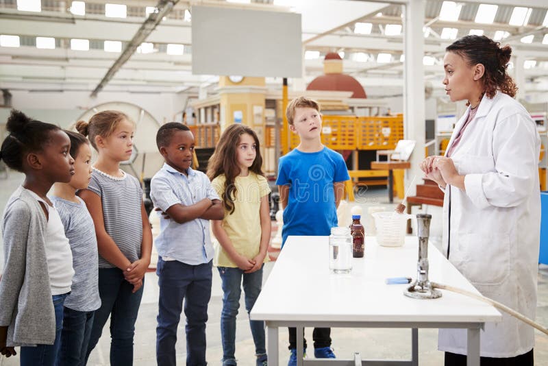 Lab Technician Carrying Out Experiment for a Group of Kids Stock Photo ...