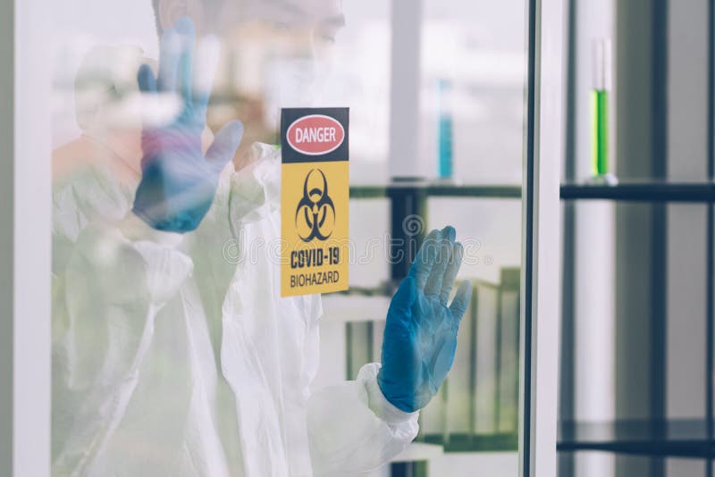 Lab Technician in Personal Protective Equipment PPE Suit Touching ...