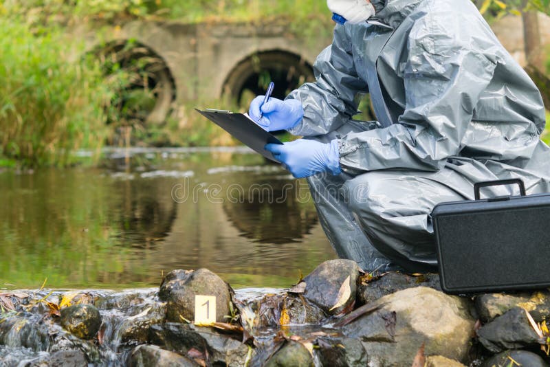 Lab Technician in Protective Suit Records Environmental Analyzes after ...