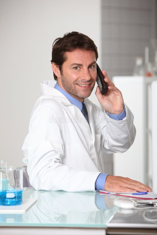 Lab Technician on the Telephone Stock Photo - Image of experimentation ...