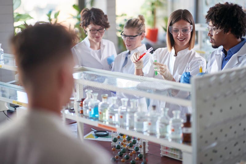 Lab Technicians Looking Liquid in Test Tubes Stock Image - Image of ...