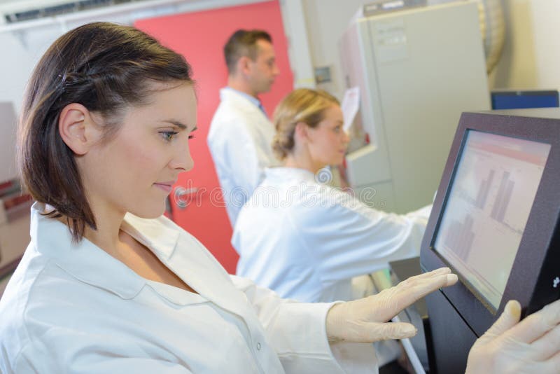Lab technicians at work stock image. Image of computer - 118381359