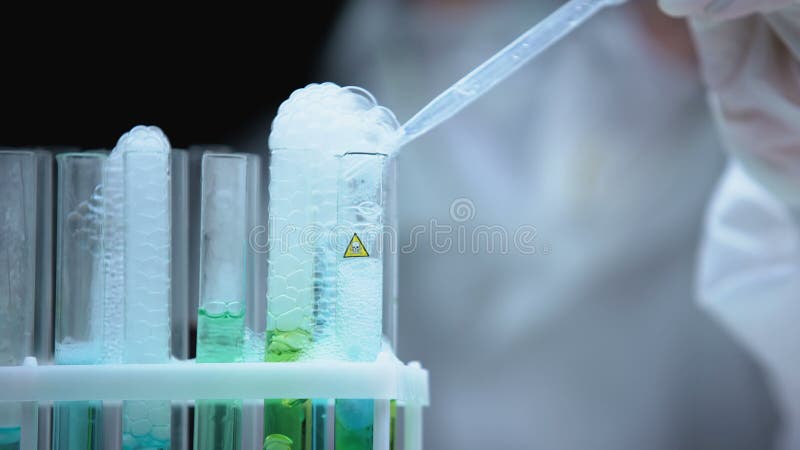 Lab Worker Adding Liquid in Test Tube with Boiling Poison, Antidote ...