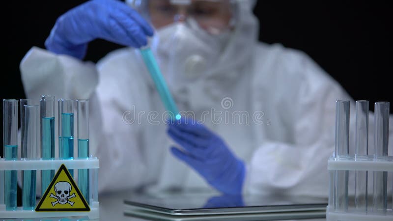 Lab Worker Inspecting Test Tubes with Poison for Sediments, Dissolution ...