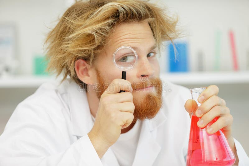 Lab Worker with Magnifying Glass Stock Image - Image of young ...