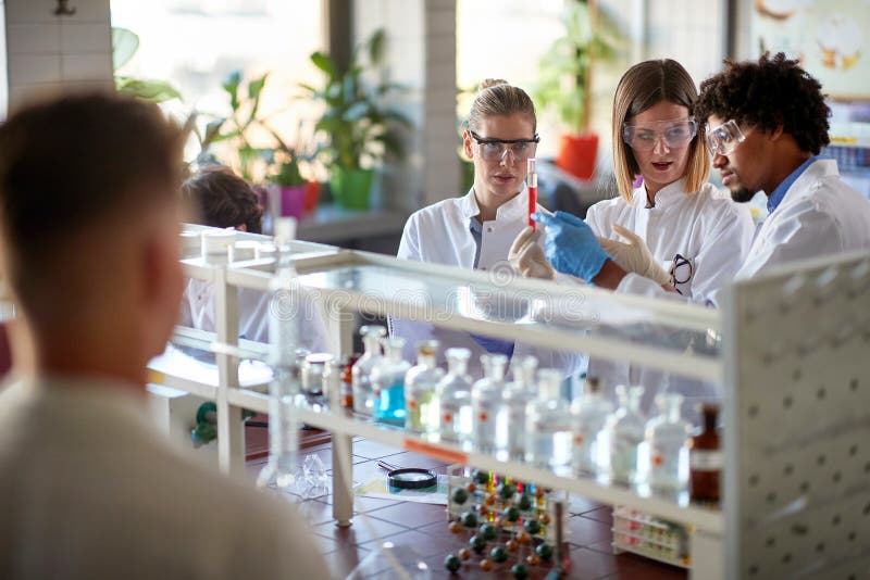 Lab Workers Analyze Contents in Test Tube Stock Image - Image of people ...