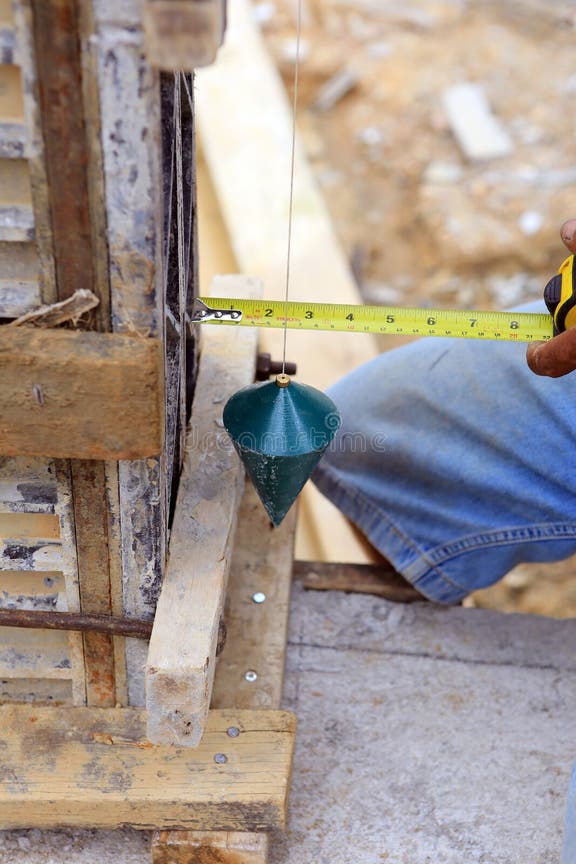 Labor Man Using a Plumb Bob for Check Stock Photo - Image of helmet ...