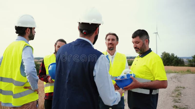 Labor Safety Inspector Talking and Giving Helmets To Construction ...