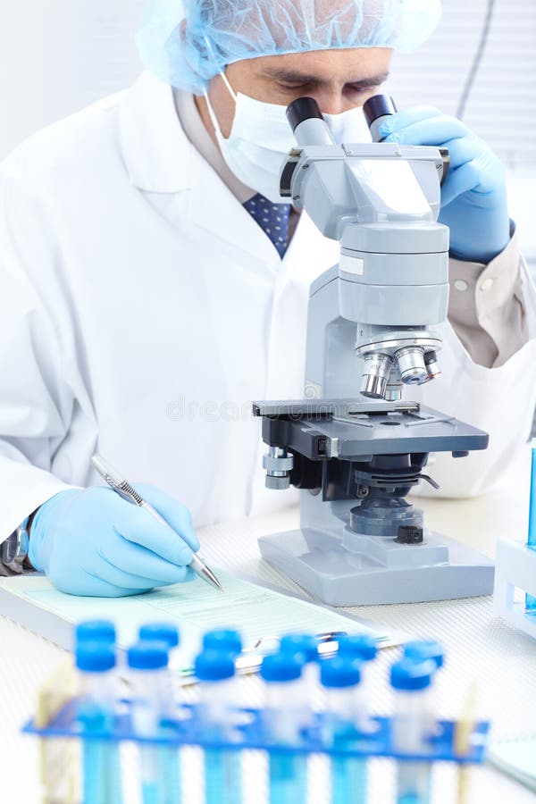 Doctor Using a Microscope stock photo. Image of hospital - 4891592