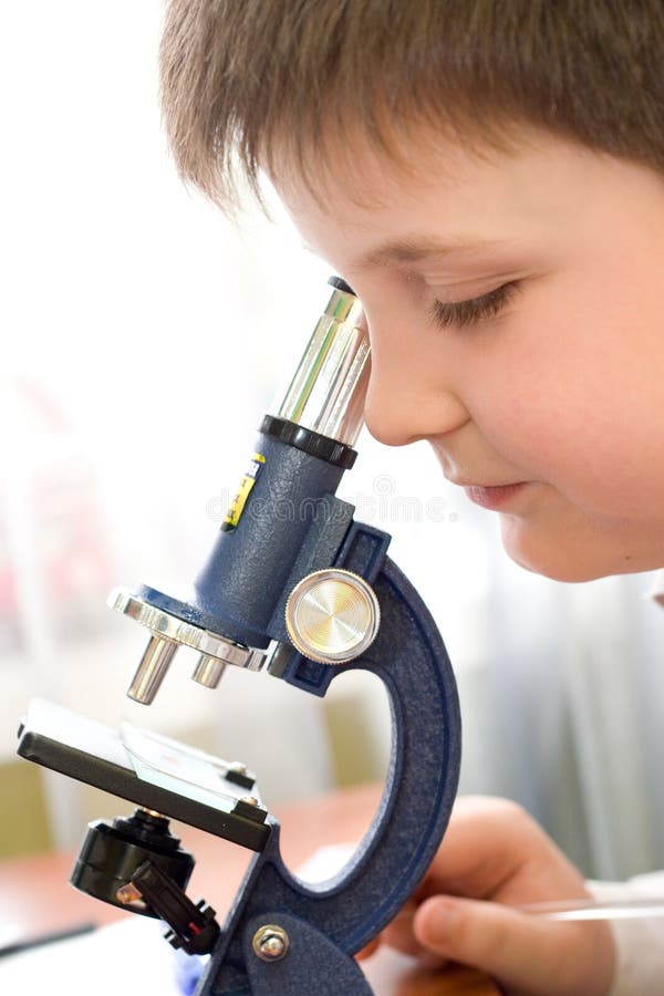 Kids using microscope stock photo. Image of exploring - 19821086