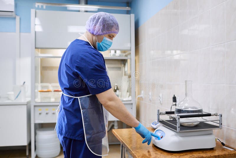 A Laboratory Assistant Conducts Research with Biomaterial in the ...